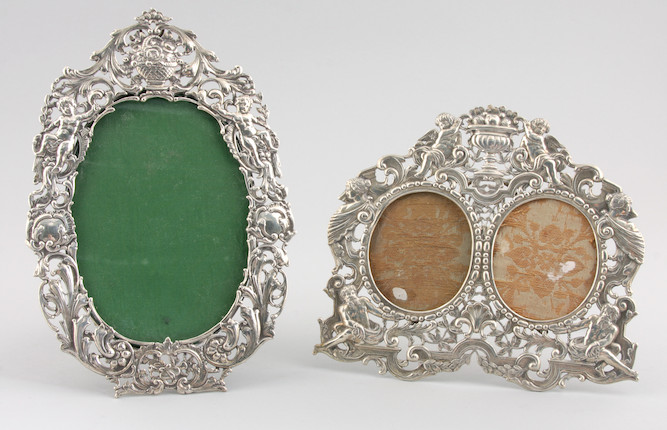 Bonhams : A group of three German silver figural easel-back photo frames