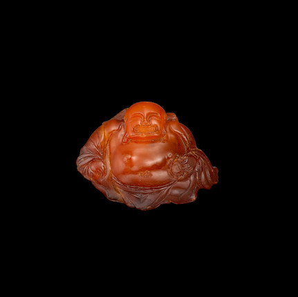 Bonhams : An amber carving of the Budai heshang 17th century