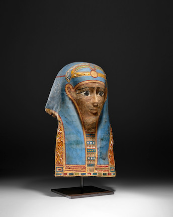 Bonhams : An Egyptian polychrome painted cartonnage mummy mask