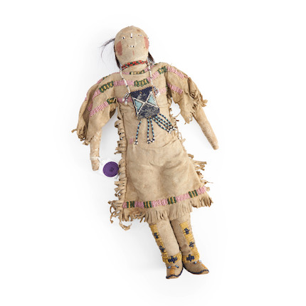 Bonhams Skinner : A Plains beaded hide doll ht. 15 in.