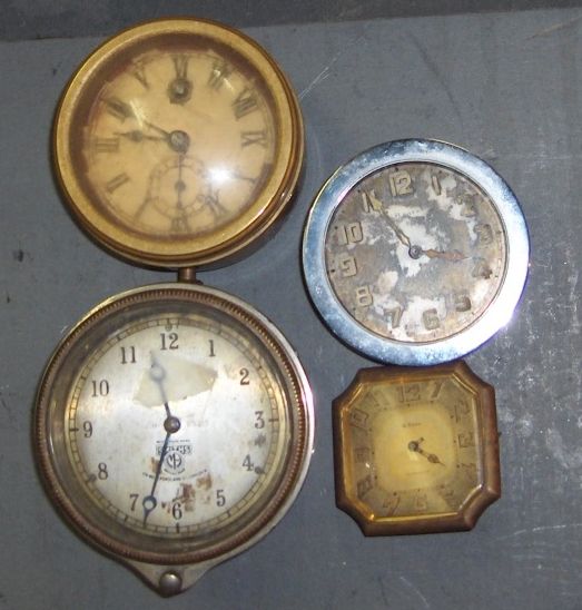 Bonhams Cars : A grouping of four car clocks,