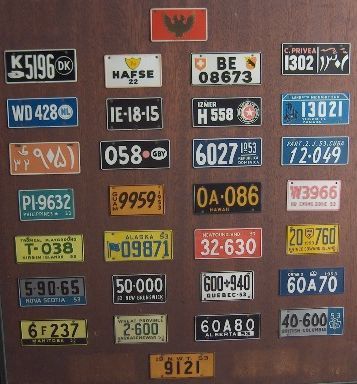 Bonhams Cars : A mounted display of thirty miniature license plates, 1953,
