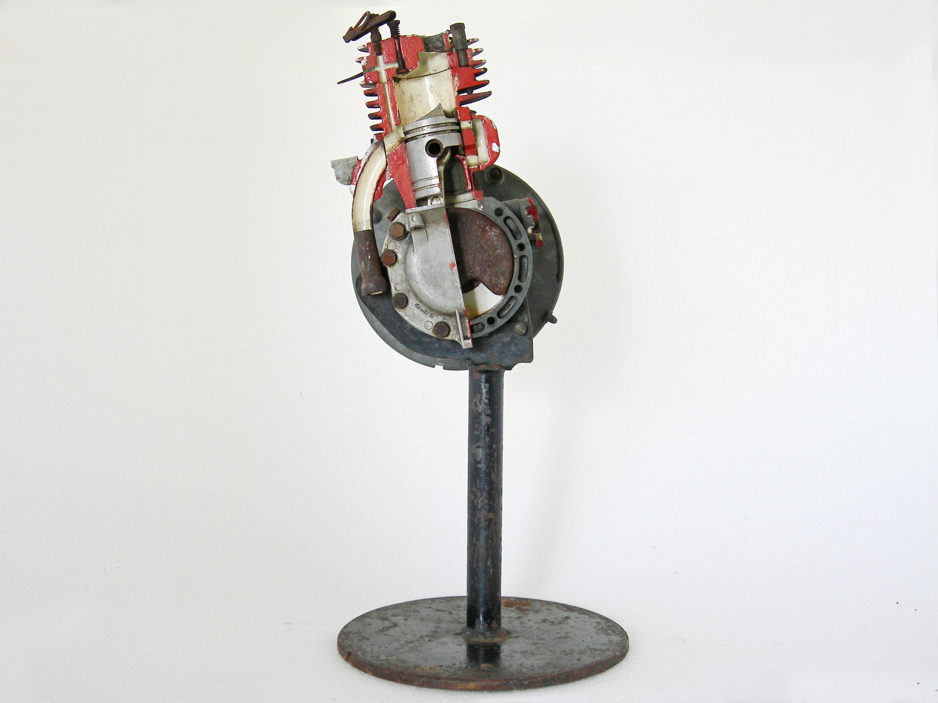 Bonhams Cars : A very small two stroke cutaway engine.