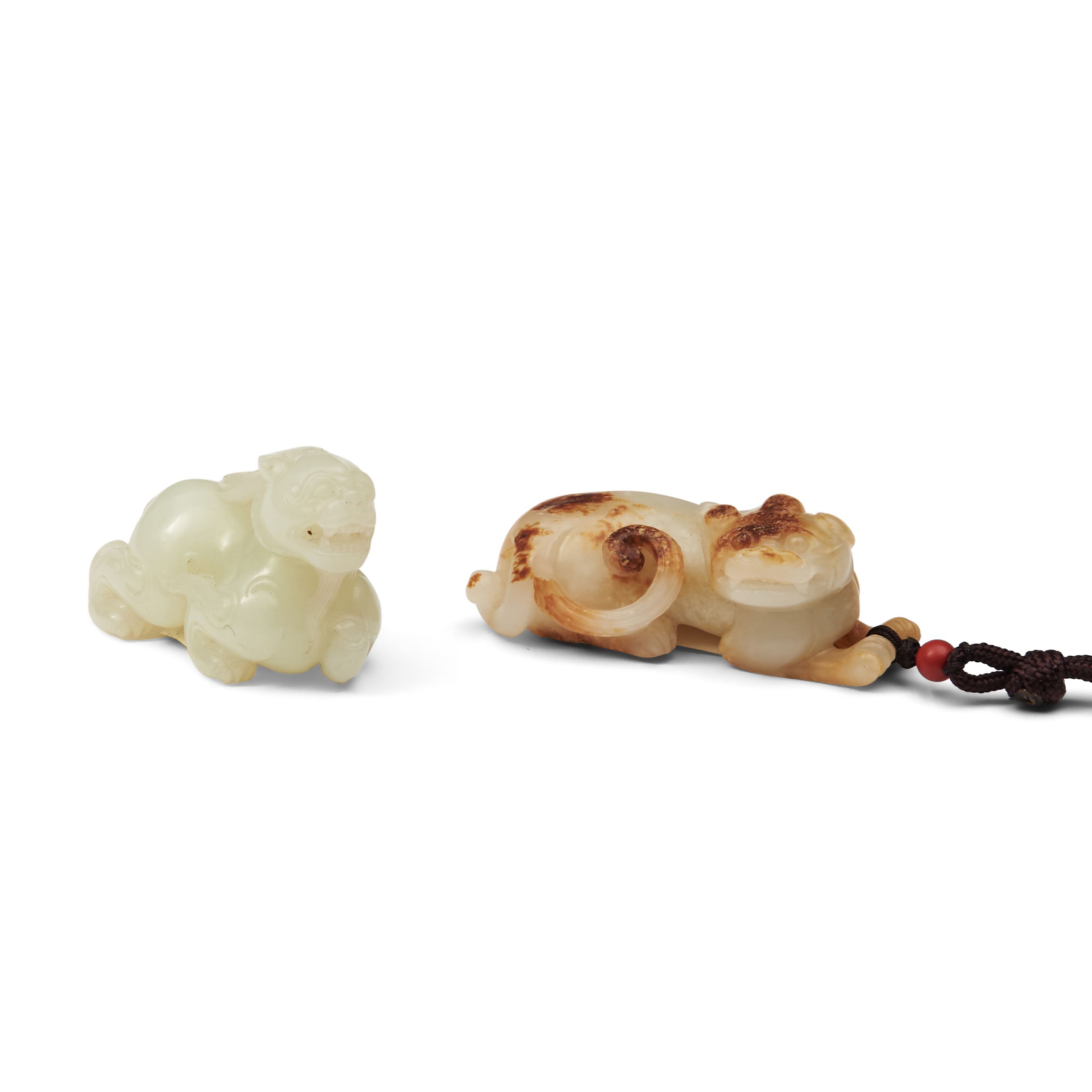 Bonhams Skinner : Two Nephrite Jade Carvings of Mythical Animals