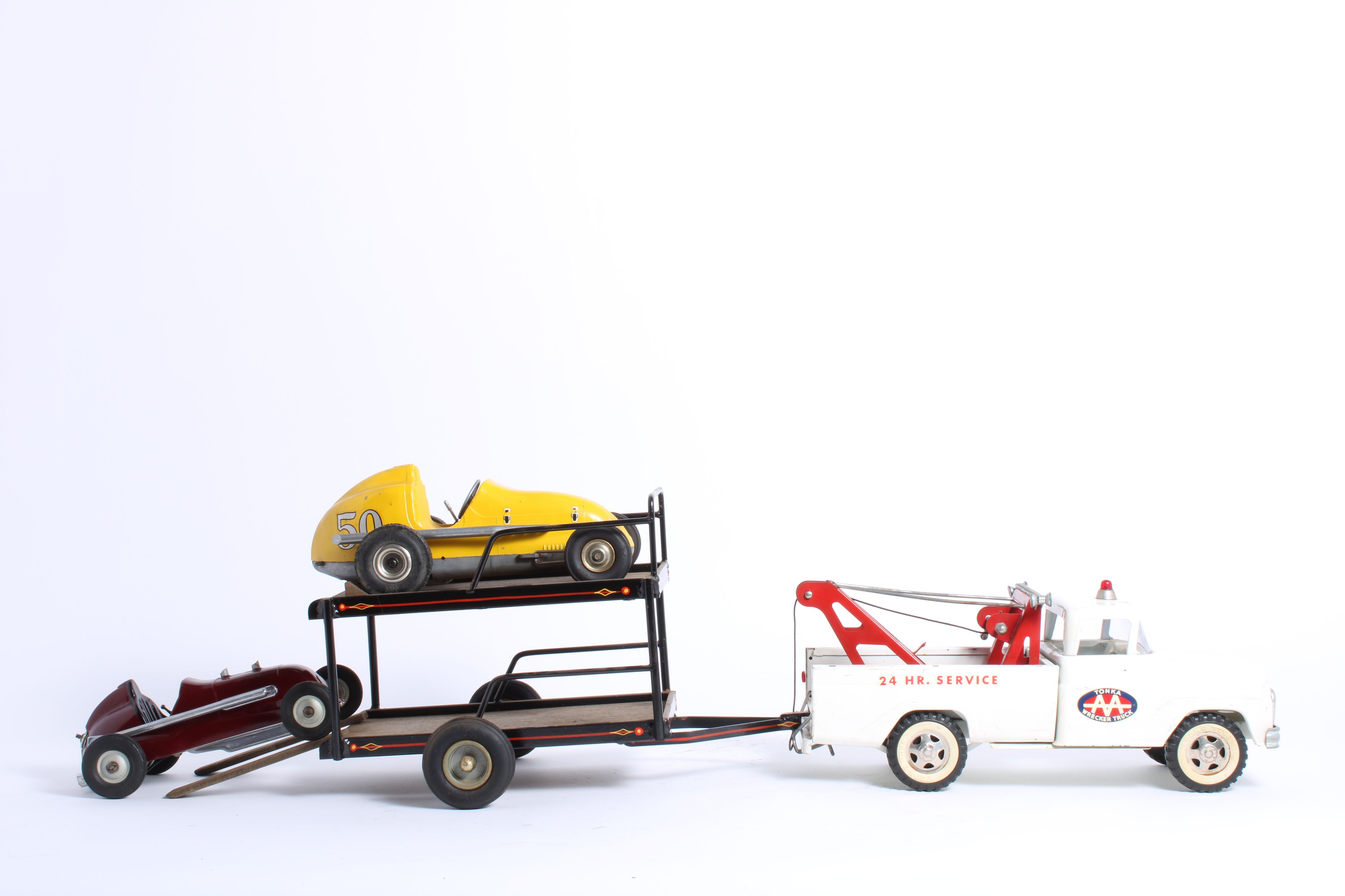 Bonhams Cars : A Tonka Wrecker Truck towing two tether race cars on a ...