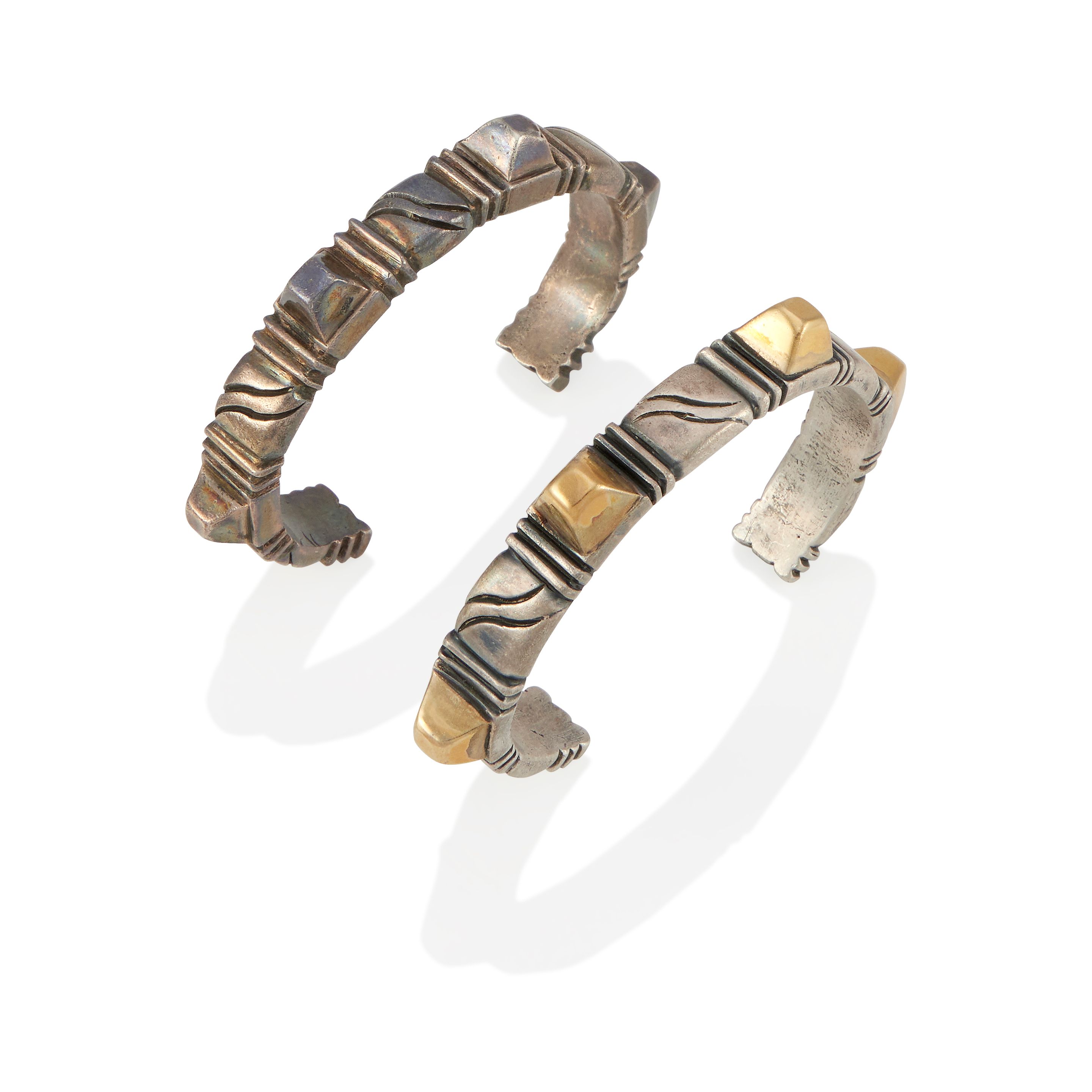 Bonhams : WILLIAM SPRATLING TWO SILVER AND 18K GOLD 'PYRAMID' CUFF BRACELETS