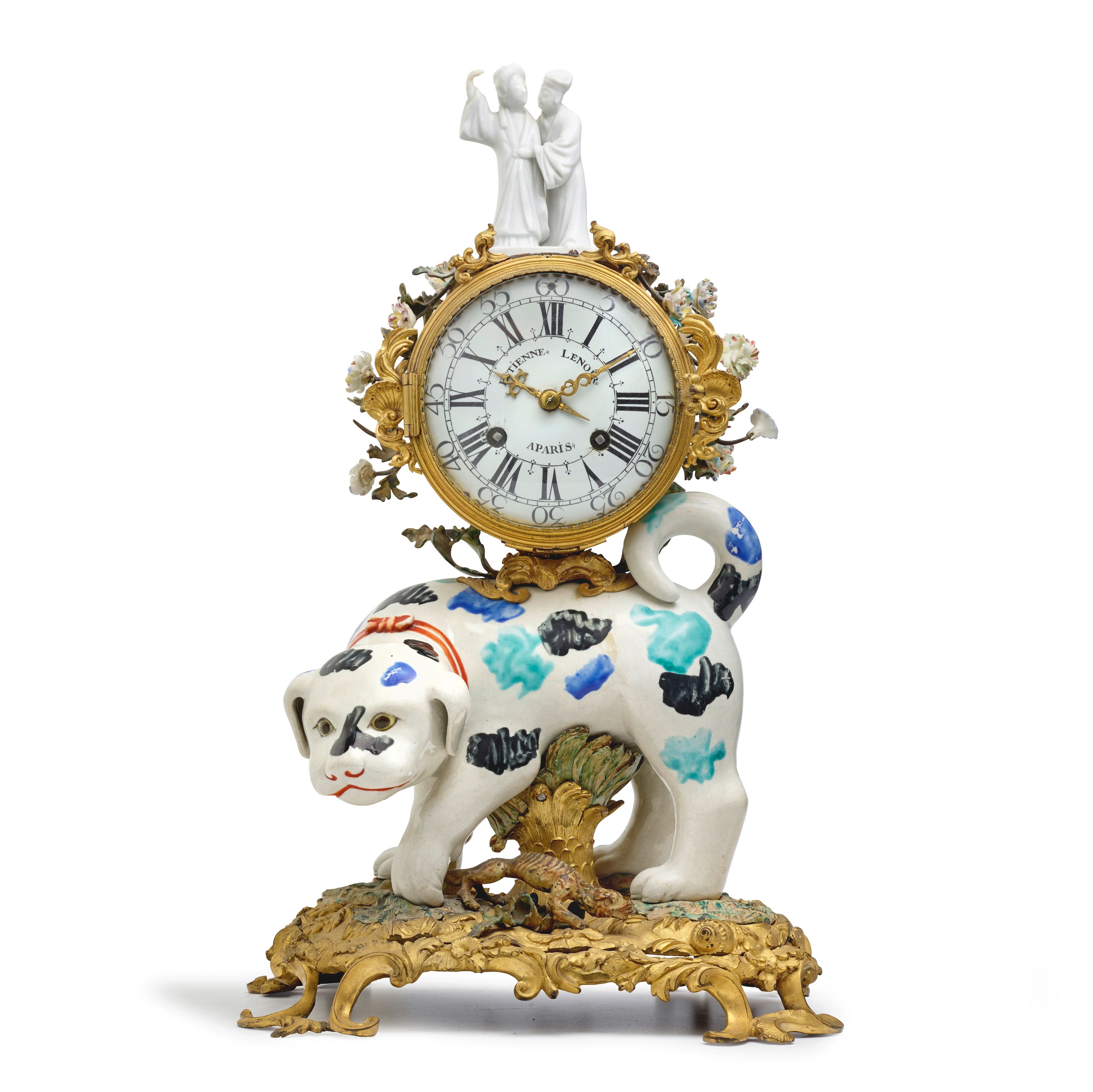 Bonhams : AN ARITA FIGURE OF A PUPPY, SUPPORTING A CLOCK WITH ORMOLU ...