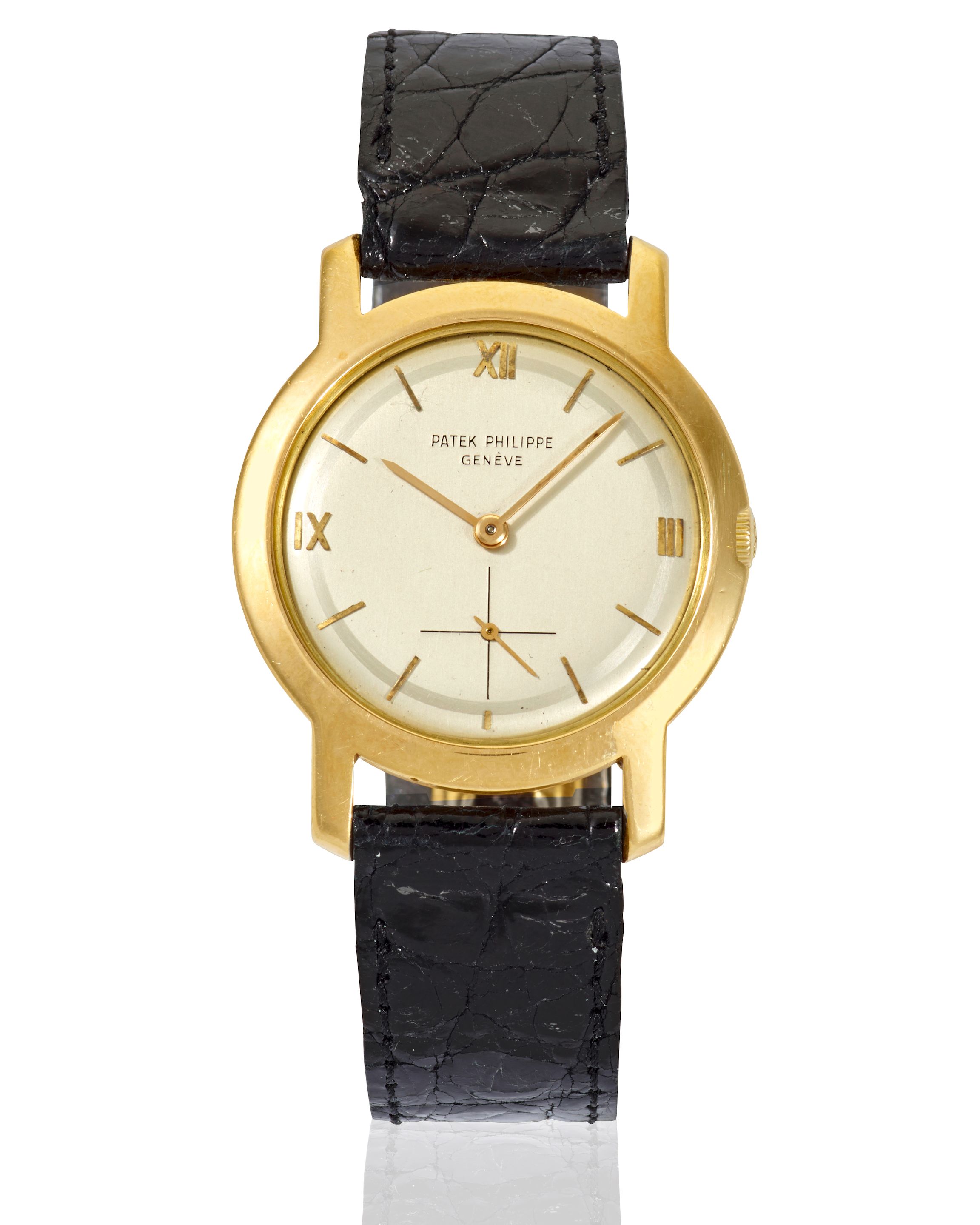 Bonhams : PATEK PHILIPPE. AN 18K GOLD MANUAL WIND WRISTWATCH Calatrava ...