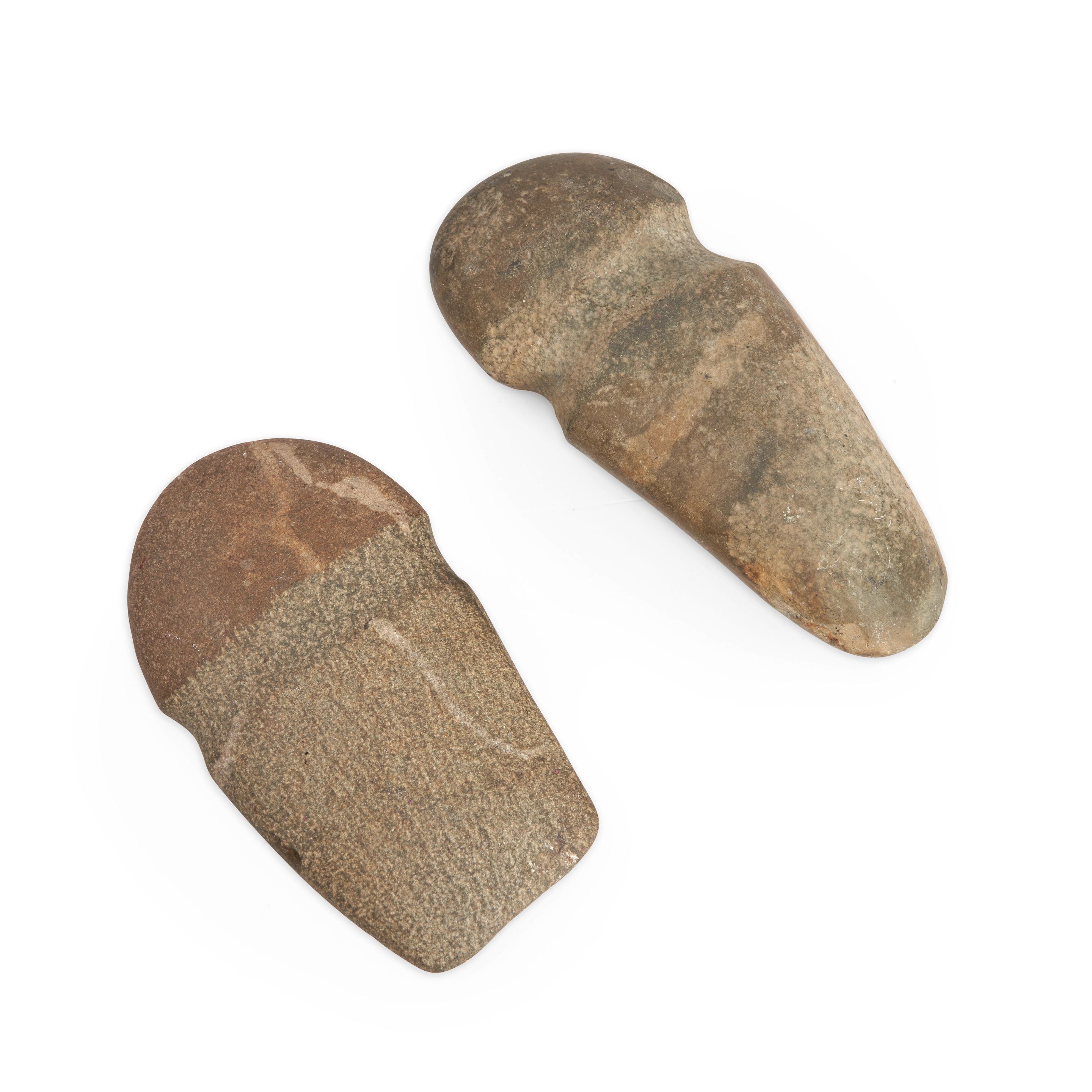 Bonhams Skinner : Two prehistoric grooved stone axe blades lg. 8, and 7 in.