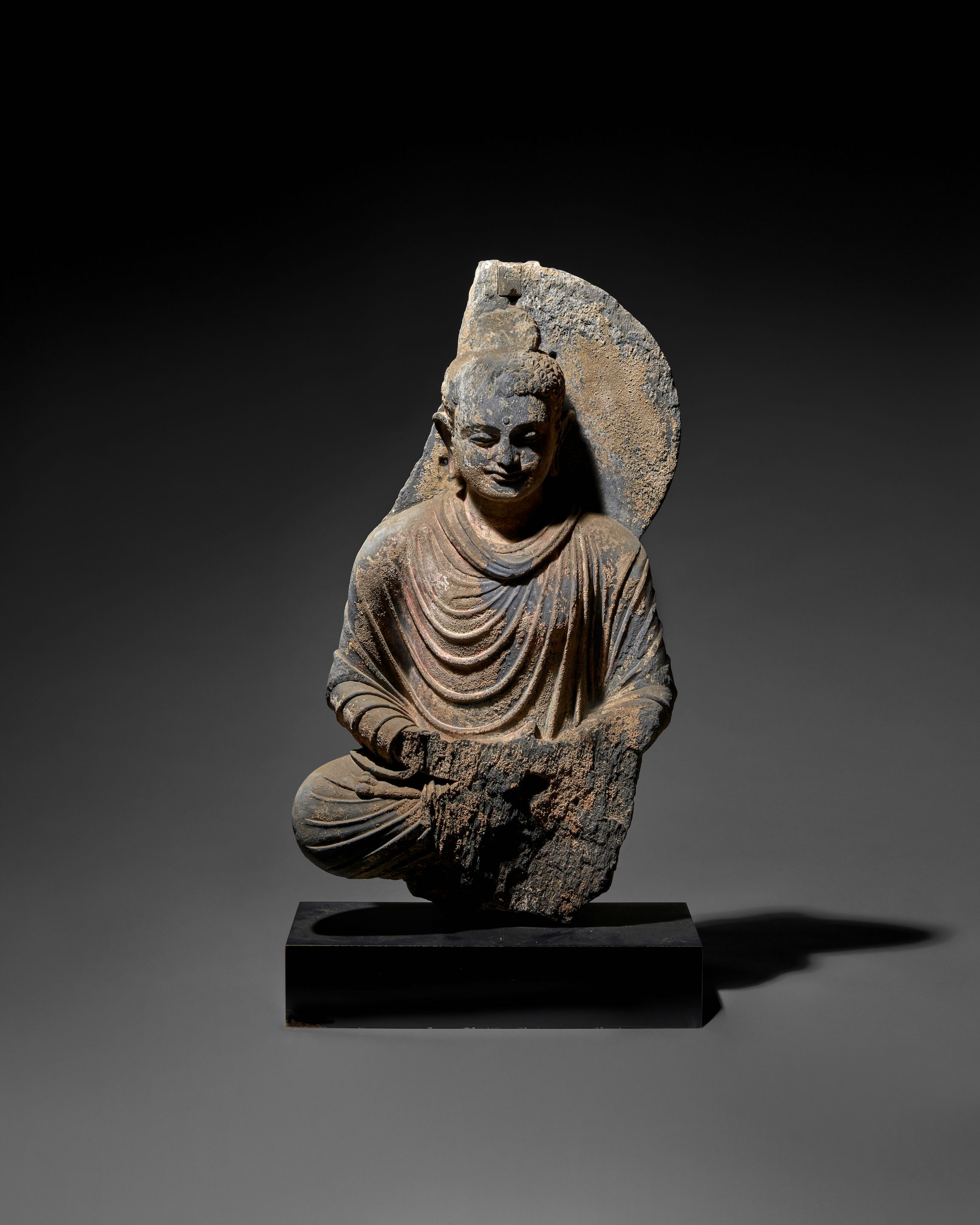Bonhams : A GREY SCHIST FIGURE OF BUDDHA ANCIENT REGION OF GANDHARA, CIRCA 3RD CENTURY