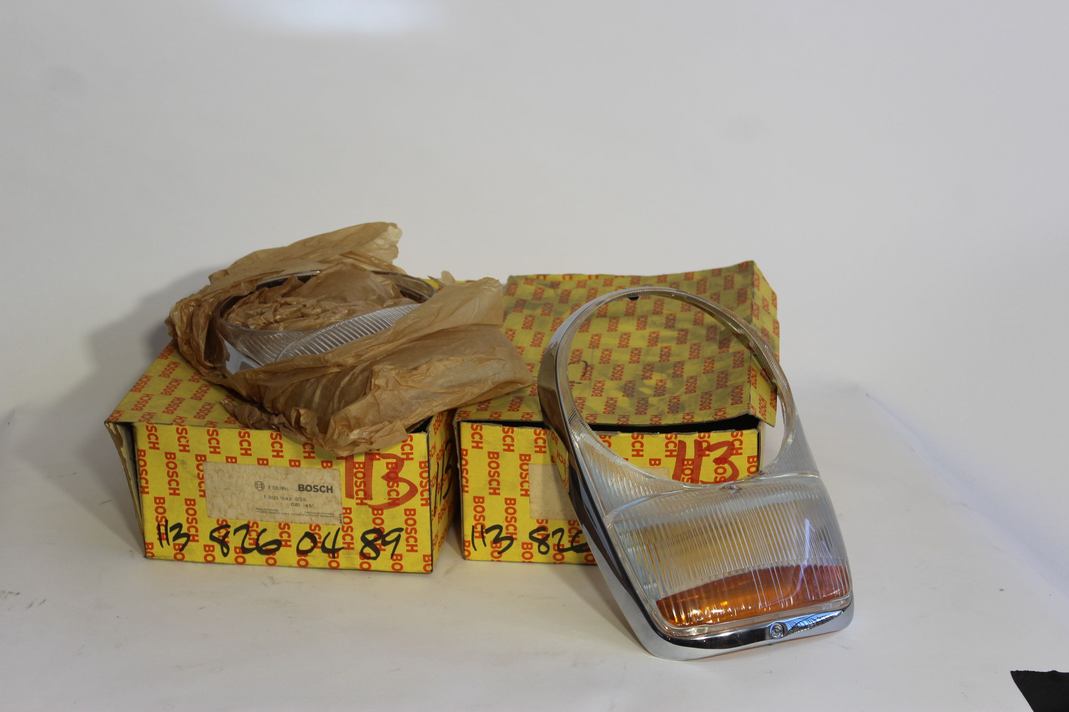 Bonhams Cars : A set of NOS, Bosch headlight bezels for a Mercedes-Benz W113,