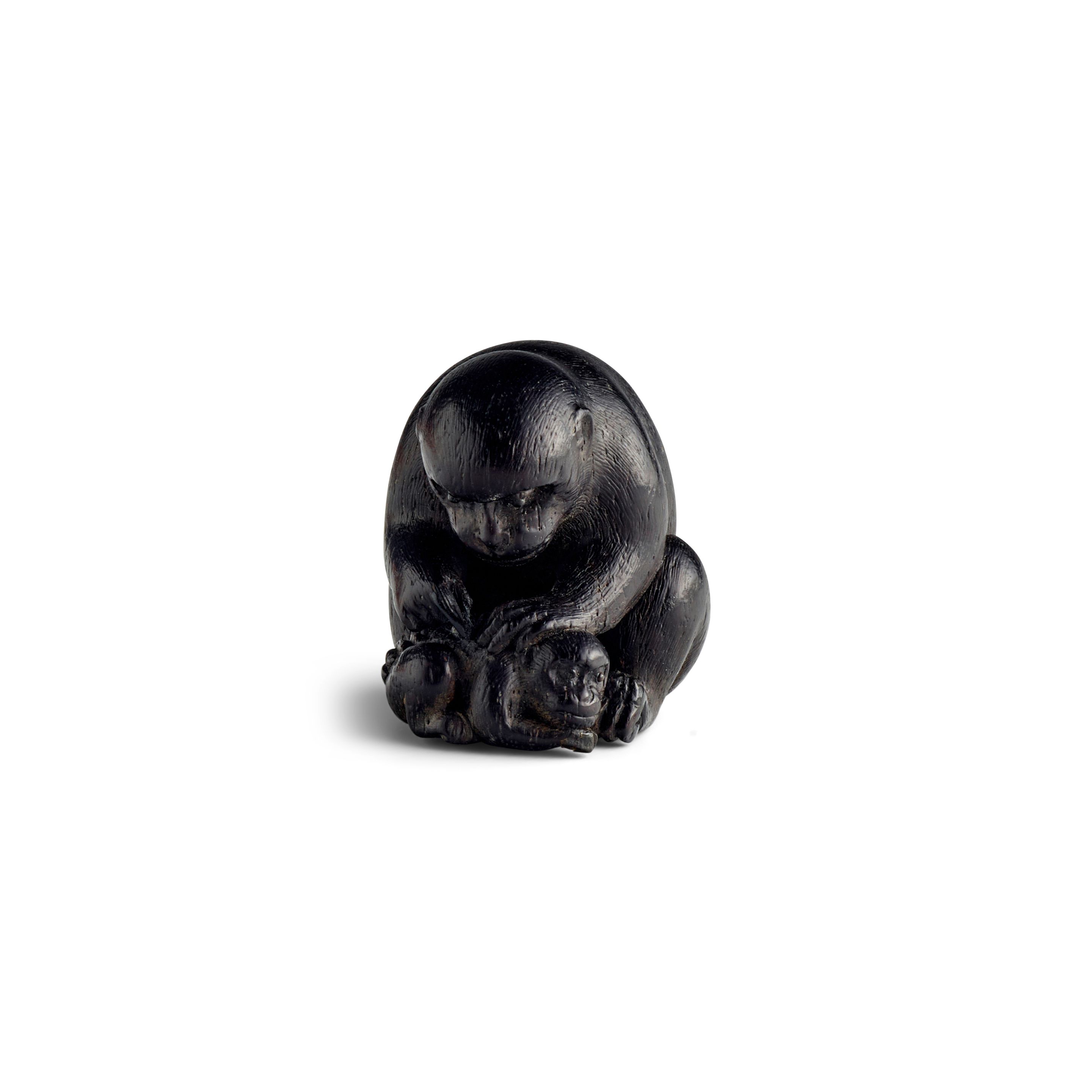 Bonhams : OKATOMO (ACTIVE LATE 18TH/EARLY 19TH CENTURY) An Ebony Wood Netsuke of a Monkey and ...
